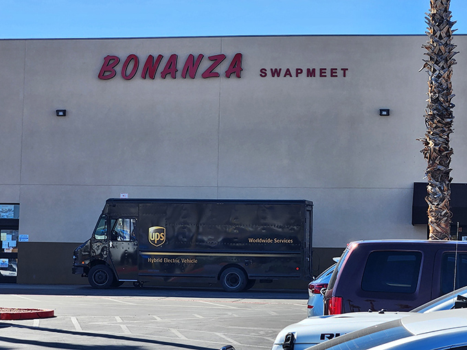 The unassuming exterior of Bonanza Swapmeet, where Las Vegas's greatest treasures hide behind beige walls and bold red letters. Retail adventure awaits!