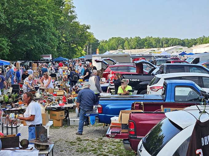 The outdoor market at Jamie's buzzes with treasure hunters navigating a sea of pickup trucks and tables laden with potential finds.