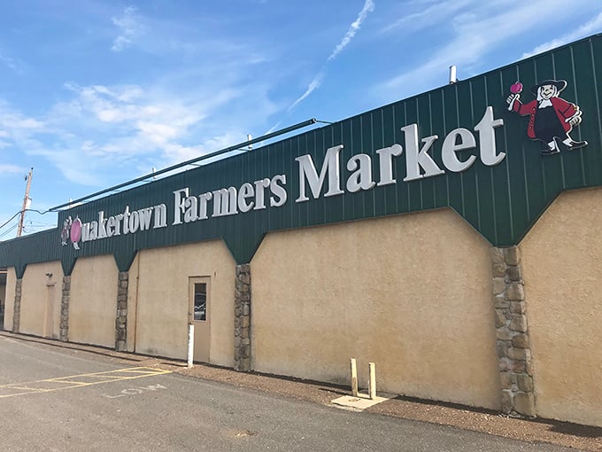 The iconic green facade of Quakertown Farmers Market welcomes treasure hunters with its charming vintage signage and promise of discoveries within.