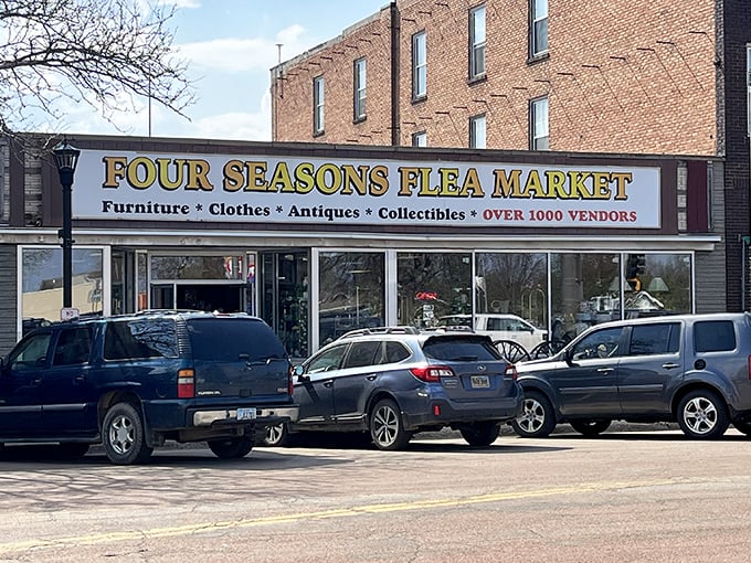 The iconic storefront of Four Seasons Flea Market beckons with promises of treasures waiting inside this Madison landmark.