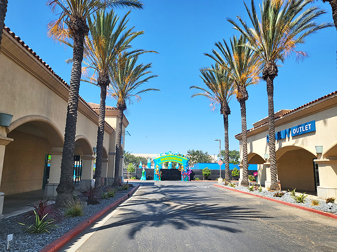 Palm trees stand like elegant sentinels along the shopping corridors, creating that quintessential California vibe while you hunt for bargains between stores.