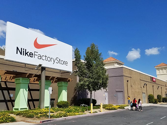 The iconic Nike Factory Store entrance beckons bargain hunters with its clean lines and promise of athletic wear that won't break your workout budget.