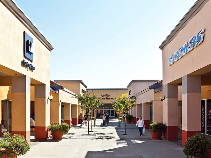 Gap's storefront stands like a beacon of affordable style, where California sunshine illuminates pathways to fashion finds that won't require a second mortgage.