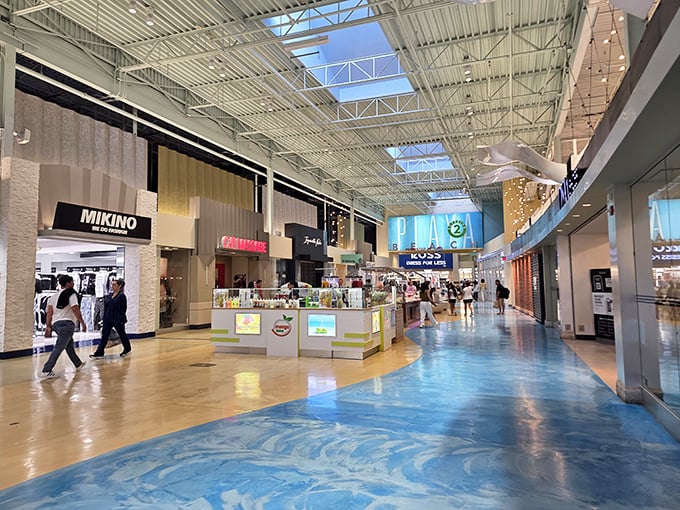 Spacious corridors with gleaming floors and natural light create an upscale shopping atmosphere that belies the outlet prices.