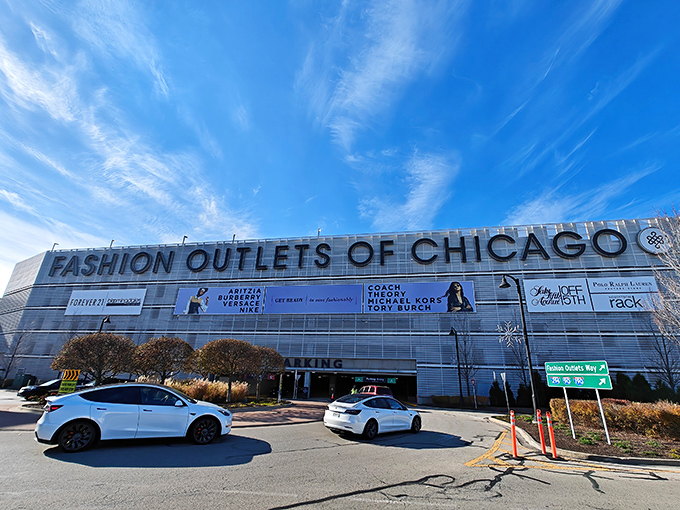The Fashion Outlets of Chicago stands like a retail fortress against the Illinois sky, promising treasure hunts where designer dreams meet discount reality.