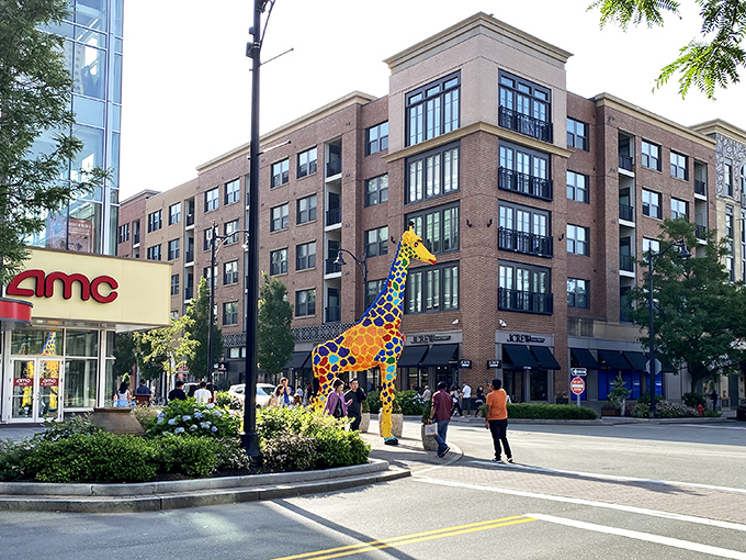 Assembly Row's colorful giraffe sculpture welcomes shoppers to this brick-fa&ccedil;ade paradise where retail therapy meets riverside relaxation.