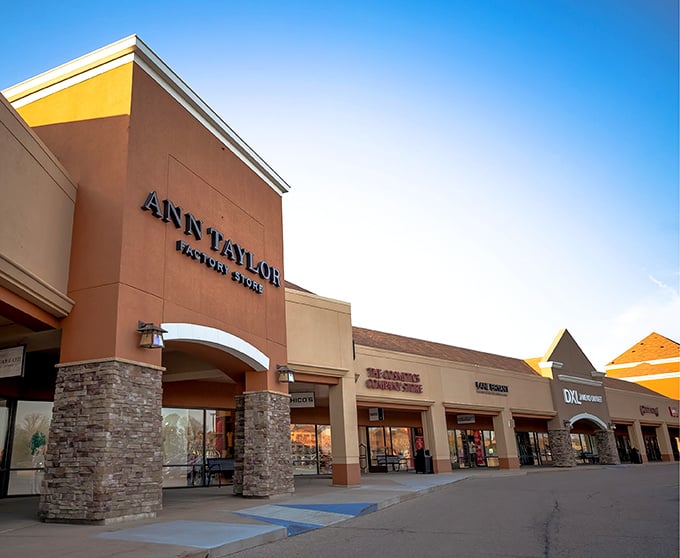 The Ann Taylor storefront stands as just one of over 100 premium brands beckoning shoppers with the siren song of "additional 40% off" signs.