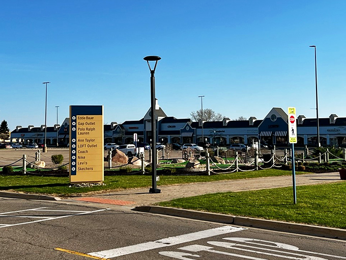 Colonial-style architecture and neatly arranged storefronts welcome bargain hunters to Kensington Valley Outlets, where retail therapy comes with a side of Michigan charm.