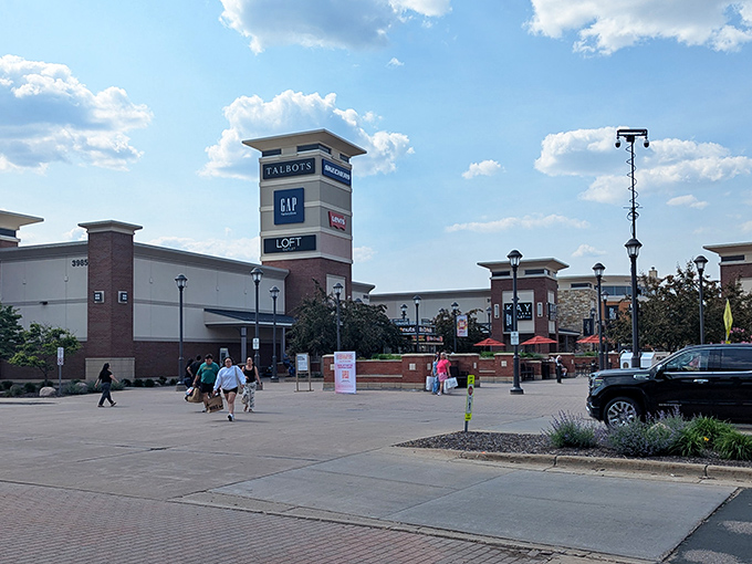 The iconic tower at Twin Cities Premium Outlets stands like a retail lighthouse, guiding bargain hunters to fashion salvation in Eagan.
