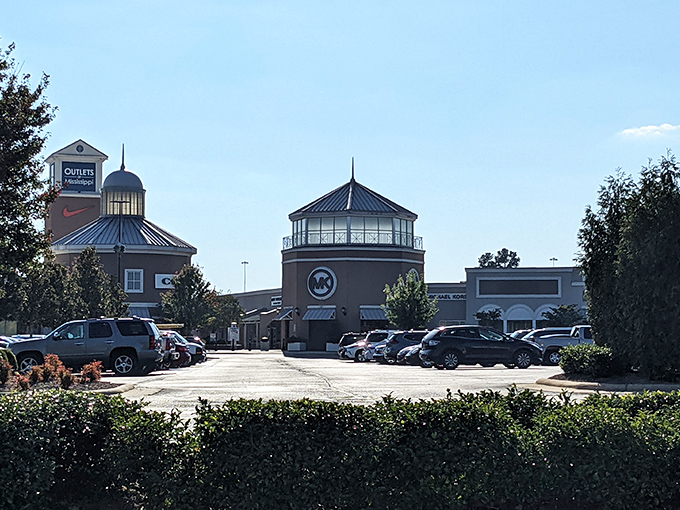 A shopper's paradise under Mississippi blue skies. The distinctive towers of the outlet mall create a retail skyline worth the drive from anywhere.