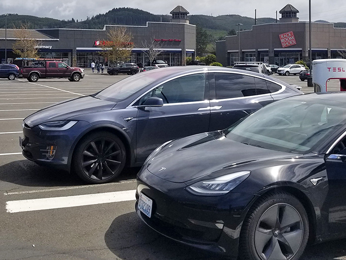 Tesla charging stations and modern storefronts prove this isn't your grandmother's outlet mall. Shopping with environmental consciousness is the new retail therapy.