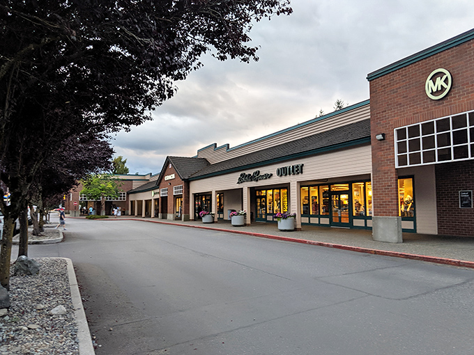 The Pacific Northwest aesthetic meets retail therapy at North Bend Premium Outlets, where mountain views and designer discounts create shopping nirvana.