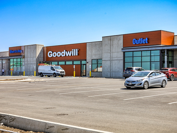 The modern exterior of Goodwill's Outlet Store in Spokane stands like a temple to thrift, where bargain hunters worship at the altar of affordability.