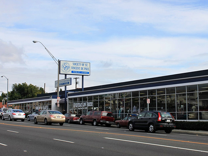 The blue-trimmed storefront stretches along the street like a retail oasis, promising treasures within that won't empty your wallet.