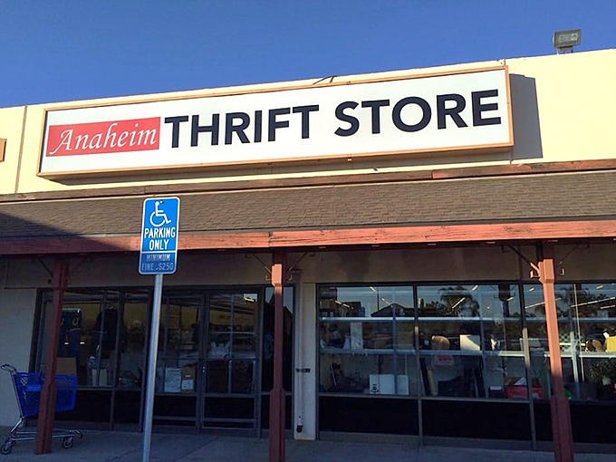 Blue skies frame this bargain hunter's paradise, where the sign might as well read "Abandon full-price shopping, all ye who enter here."