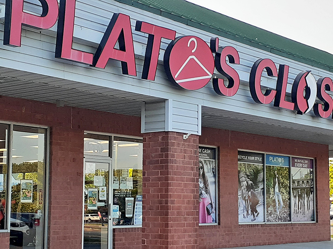 The iconic pink signage of Plato's Closet beckons like a fashion lighthouse, guiding style-seekers to a harbor of affordable finds.