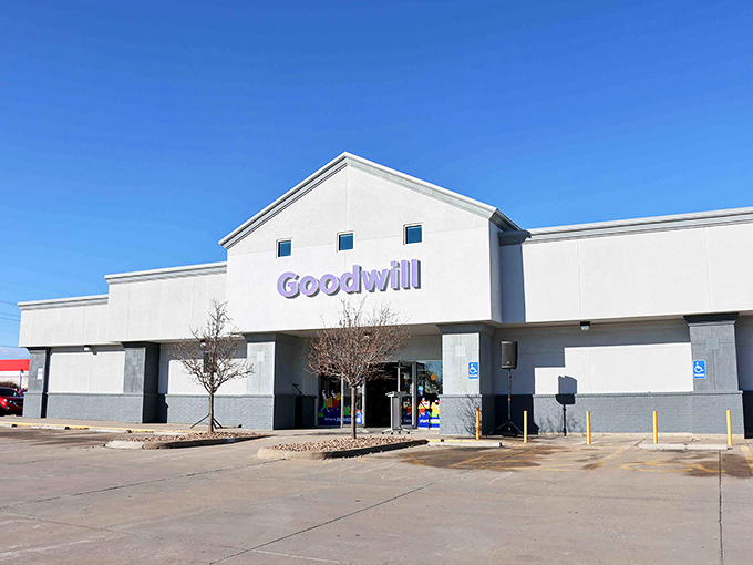The bright blue Goodwill sign beckons like a lighthouse for bargain hunters. Clean lines and ample parking&mdash;your treasure hunt begins here!