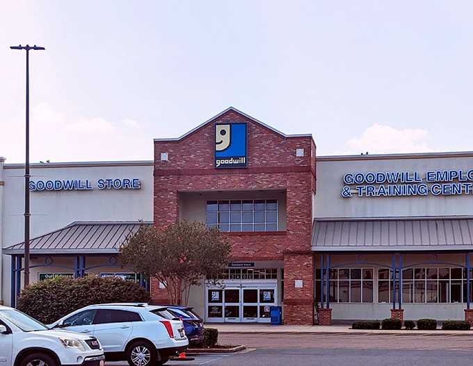 The iconic brick facade of Goodwill on Tulane Avenue stands like a temple to thrift, beckoning bargain hunters with its familiar blue smile logo.