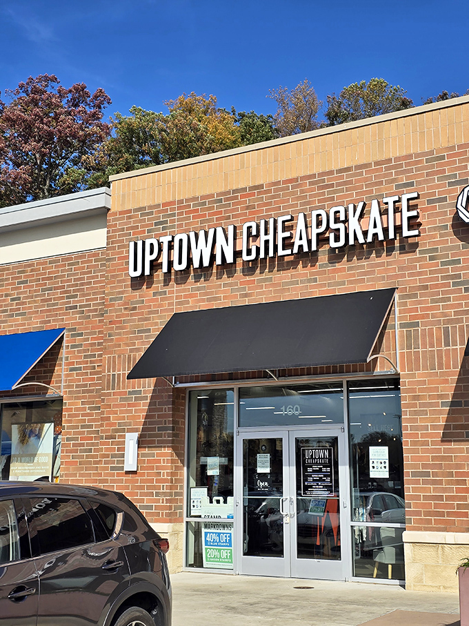The brick facade of Uptown Cheapskate beckons like a siren song to bargain hunters. Fashion paradise awaits behind those doors.