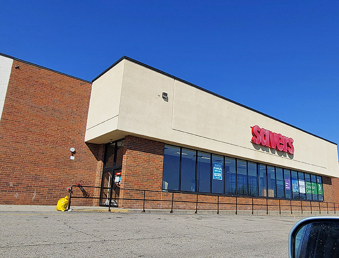 The iconic purple Savers sign beckons like a siren call to bargain hunters. Treasure awaits inside this unassuming brick building.