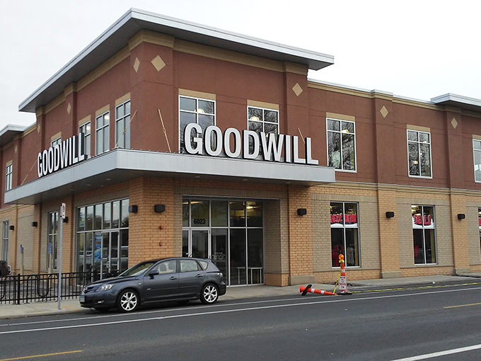 The modern brick facade of Goodwill on Nicollet Avenue stands like a retail cathedral to second chances, beckoning bargain hunters inside.