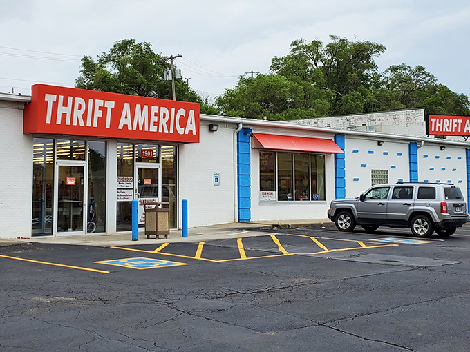 The unmistakable red sign of Thrift America stands out like a beacon for bargain hunters, promising treasures within those unassuming walls.