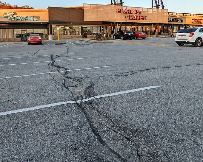 The iconic orange and blue Plato's Closet sign beckons bargain hunters like a fashion lighthouse in a sea of retail options.