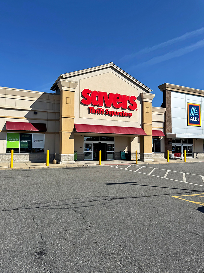The iconic red Savers sign beckons bargain hunters like a retail lighthouse guiding ships full of shoppers to the shores of sweet deals. 