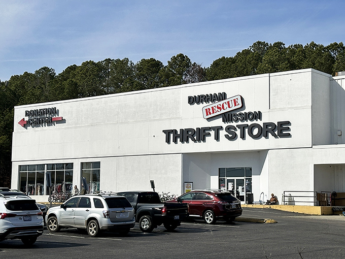 The white facade of Durham Rescue Mission Thrift Store stands like a beacon for bargain hunters, promising treasures within its expansive walls.