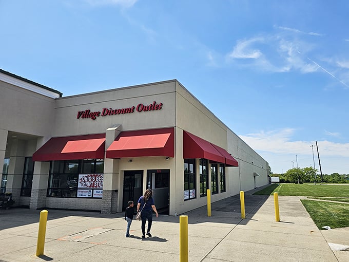 The unassuming exterior of Village Discount Outlet beckons with its signature red awnings &ndash; proof that treasure hunting doesn't require a pirate ship or complicated map.