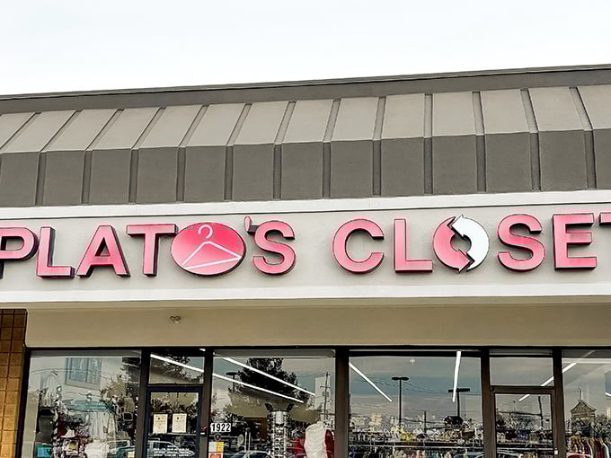 The iconic red Plato's Closet sign beckons like a fashion lighthouse, guiding bargain hunters safely away from full retail prices.