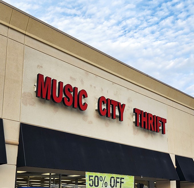 The iconic red lettering of Music City Thrift stands out against the Nashville sky, promising treasures within that won't break your bank account.