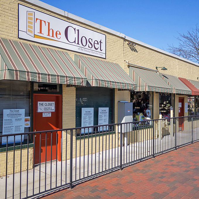 The yellow brick facade and distinctive red door of The Closet beckons bargain hunters like a thrift store Emerald City, minus the flying monkeys.