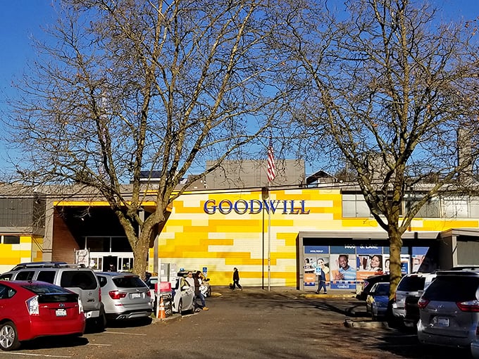 The bright yellow exterior of Seattle Goodwill stands out like a beacon of bargain-hunting hope against the Pacific Northwest sky.