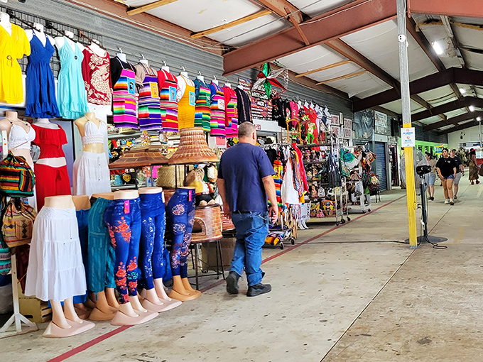 Colorful clothing paradise! Where mannequins model everything from tropical sundresses to Bob Marley tees, proving fashion treasures don't need designer price tags.