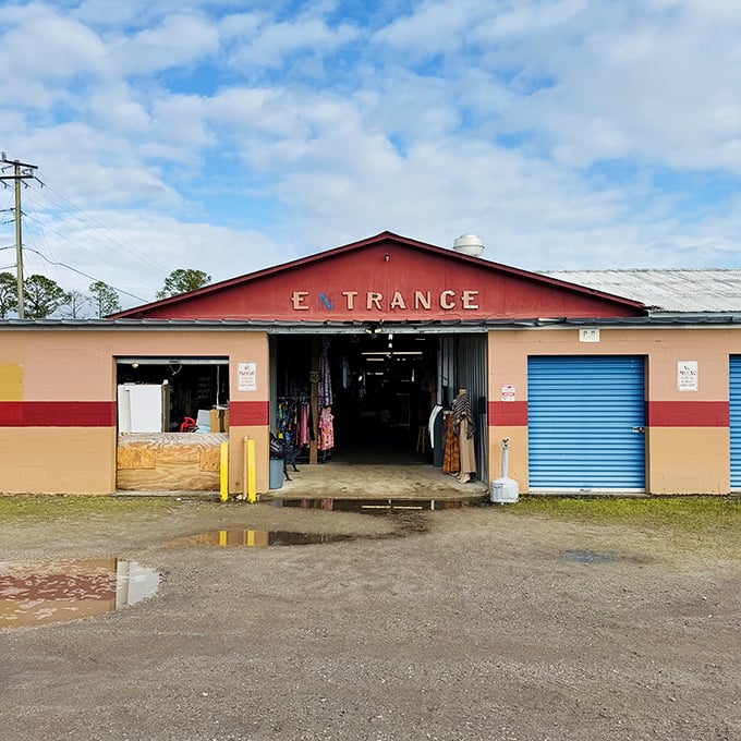 The unassuming entrance to Pecan Park Flea Market beckons like a portal to another dimension&mdash;one where treasures await behind that simple red facade.