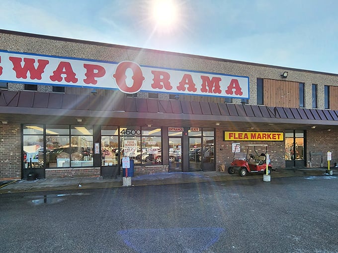 Sunbeams spotlight this temple of thrift where fortunes are found and wallets rejoice. The humble golf cart parked outside hints at the vastness waiting within&mdash;you'll need wheels to see it all.