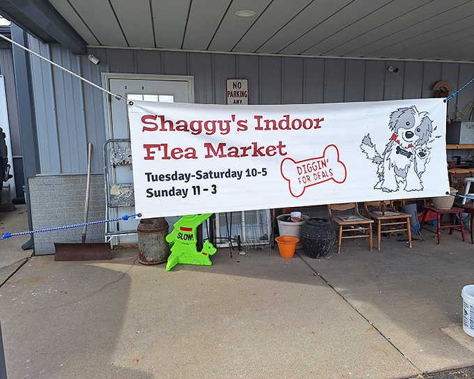 The unassuming entrance to Shaggy's Indoor Flea Market, where treasure hunting adventures begin with a cartoon mascot "diggin' for deals."