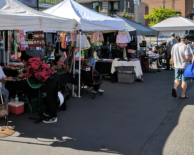 Colorful handmade clothing flutters in the Montana breeze, a textile rainbow waiting to be discovered by savvy shoppers seeking one-of-a-kind treasures.