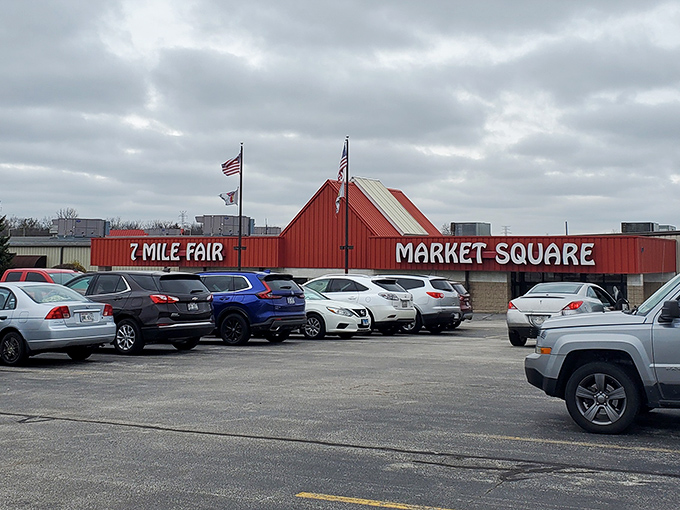 The iconic red-roofed entrance to 7 Mile Fair stands like a retail Emerald City, promising treasures beyond those automatic doors.