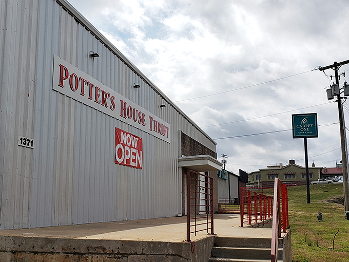 That "NOW OPEN" sign might as well say "TREASURE AWAITS" &ndash; the unassuming exterior hides a wonderland of secondhand gems inside.