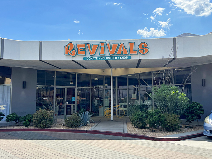 Desert modernism meets charitable mission at Revivals' Palm Springs flagship, where that iconic orange signage promises treasure hunting with purpose.