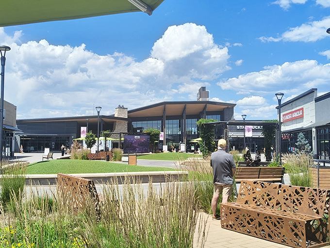 The modern oasis of Denver Premium Outlets beckons shoppers with its contemporary design, blue skies, and the promise of retail therapy without the full-price hangover.