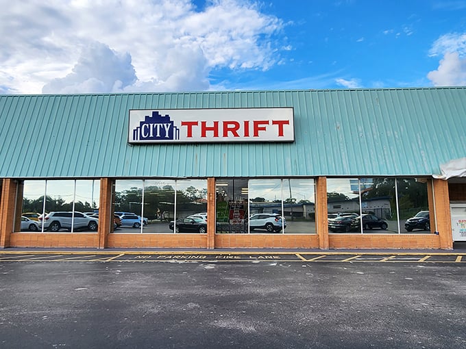 The teal facade of City Thrift stands like a beacon for bargain hunters, promising treasures behind those unassuming windows.