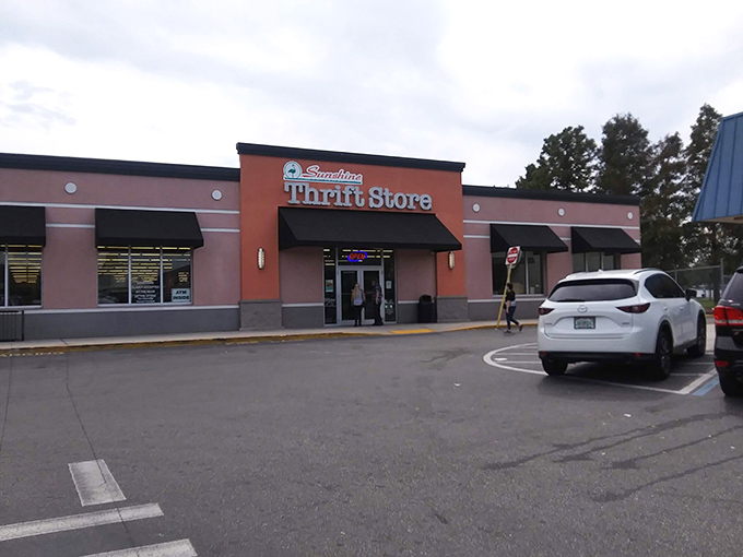 The orange facade of Sunshine Thrift beckons like a siren call to bargain hunters. Your wallet's about to have its best day ever!