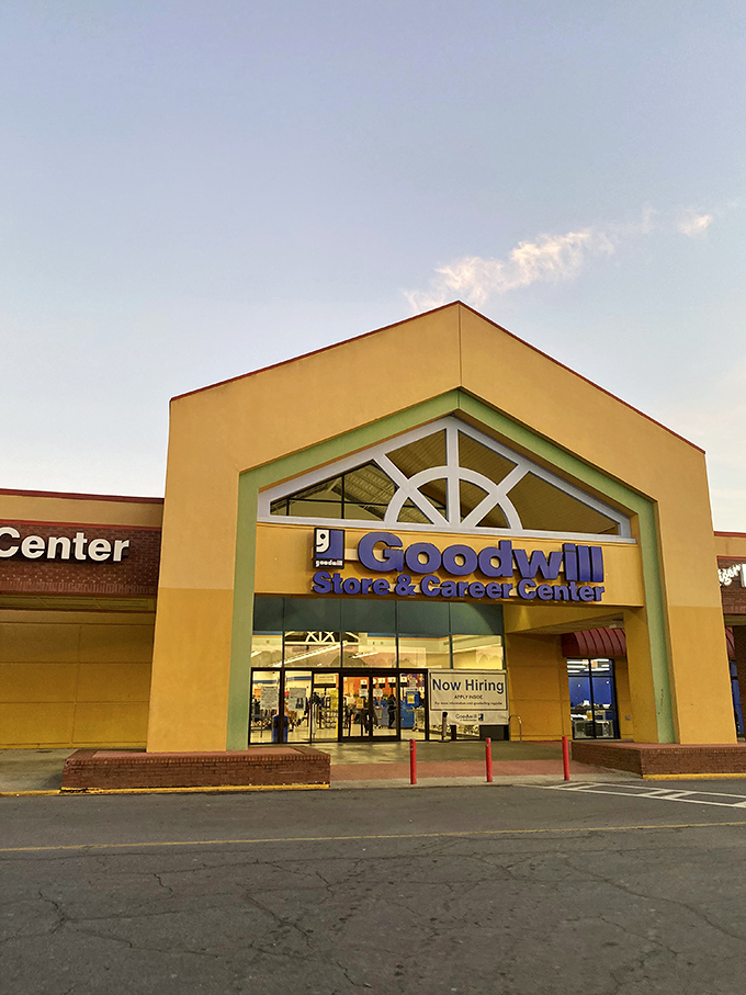 The yellow facade of Goodwill beckons like a treasure chest waiting to be opened, promising adventures in secondhand splendor on Atlanta's Buford Highway.