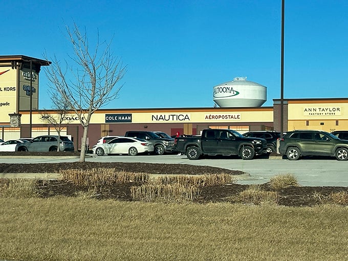 The iconic Altoona water tower stands sentinel over a retail paradise where Cole Haan, Nautica, and Aéropostale await your wallet's surrender.