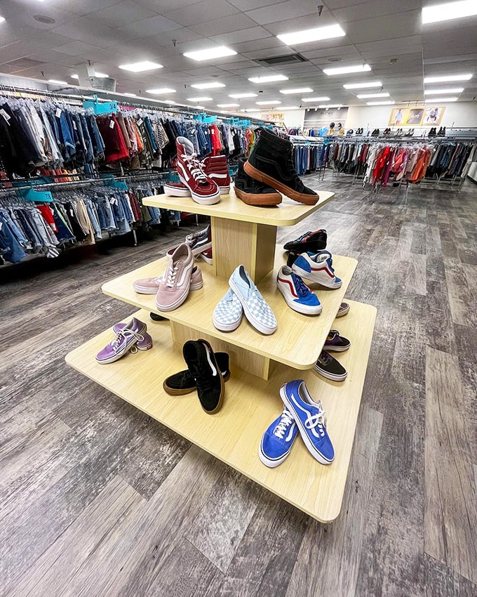 The shoe display at Plato's Closet showcases a rainbow of gently-used footwear, arranged like a museum exhibit of affordable fashion possibilities.