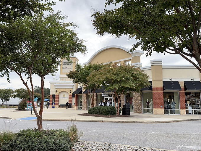 The elegant fa&ccedil;ade of Queenstown Premium Outlets welcomes shoppers with its distinctive architecture and lush landscaping&mdash;retail therapy with a side of curb appeal.