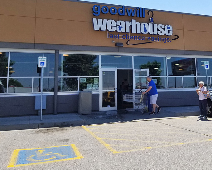 Morning shoppers arrive at the Wearhouse, where behind those modest glass doors lies a wonderland that makes Black Friday look like amateur hour.
